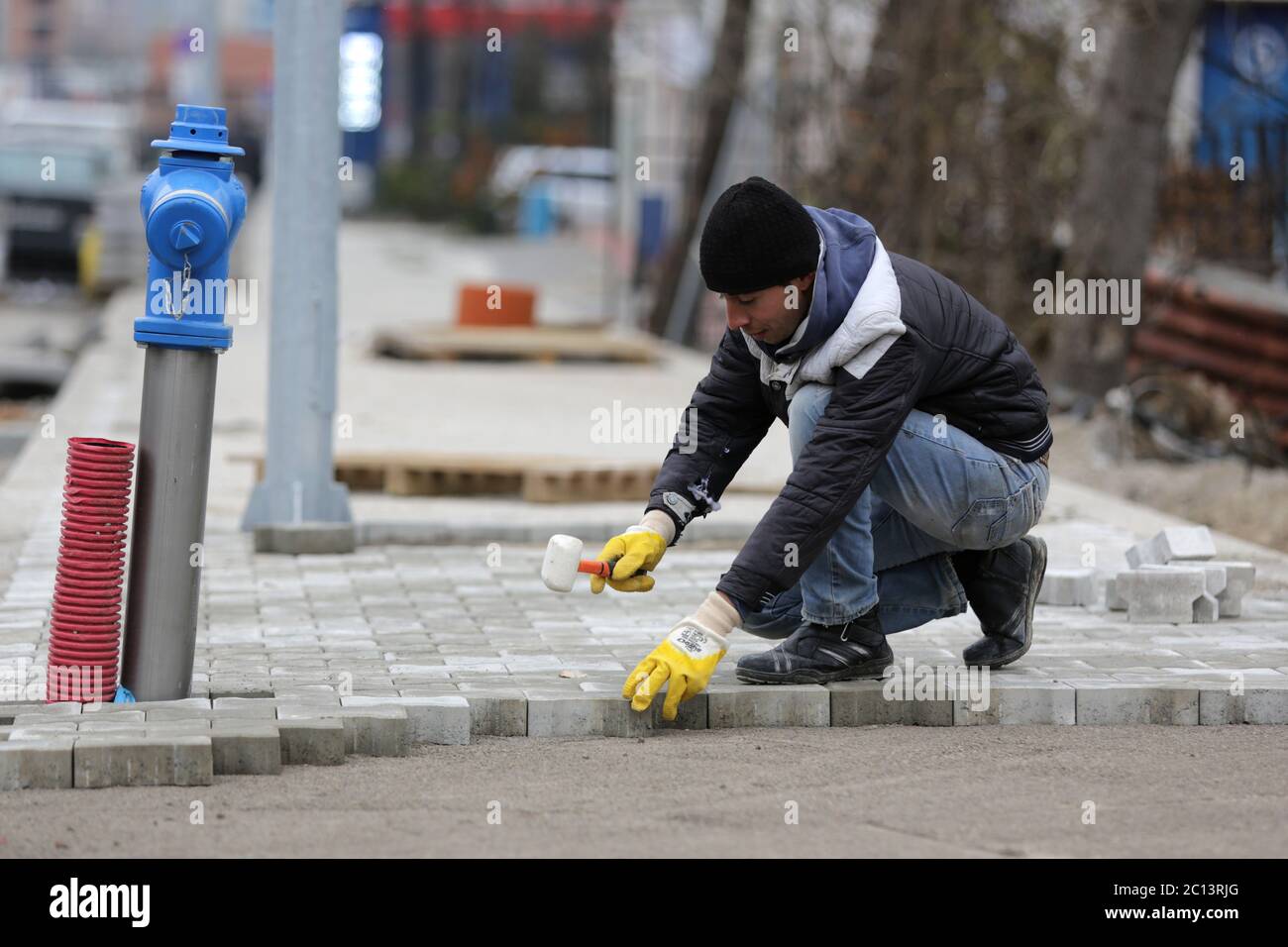Brick paver working worker hi-res stock photography and images - Alamy