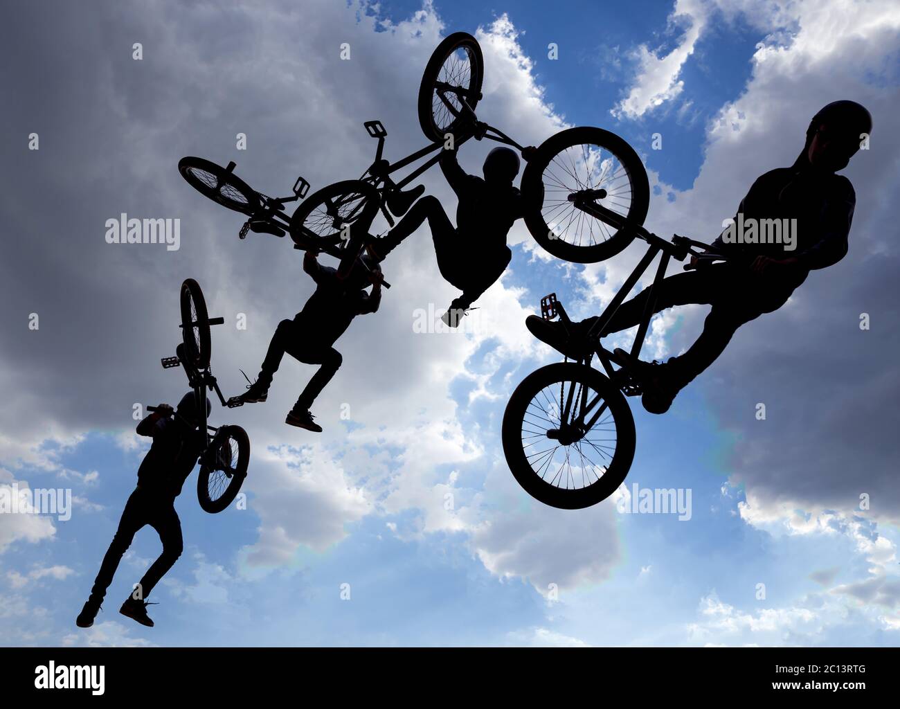 Bike jump silhouettes multiple exposure Stock Photo - Alamy