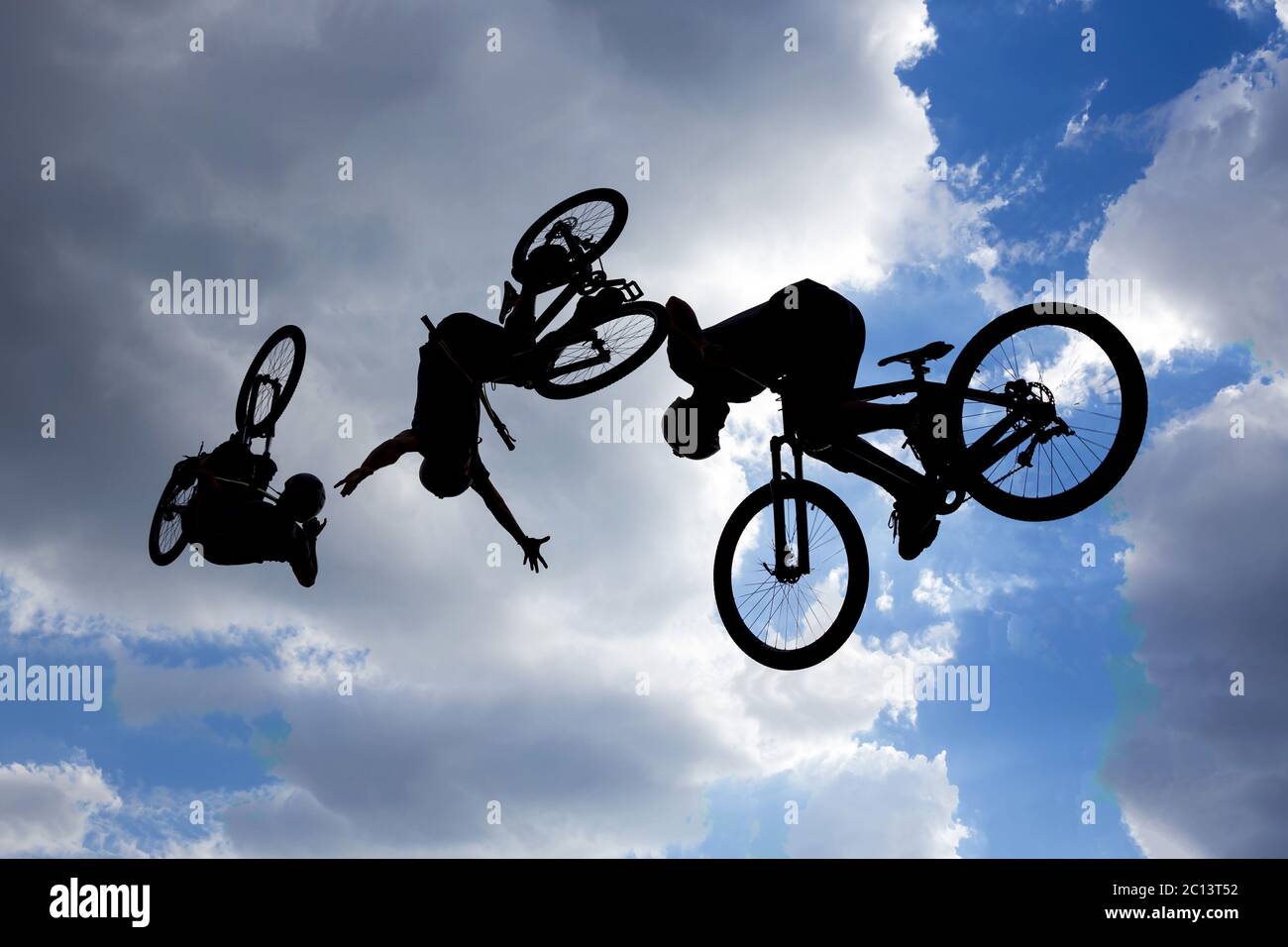 Bike jump silhouettes multiple exposure Stock Photo - Alamy