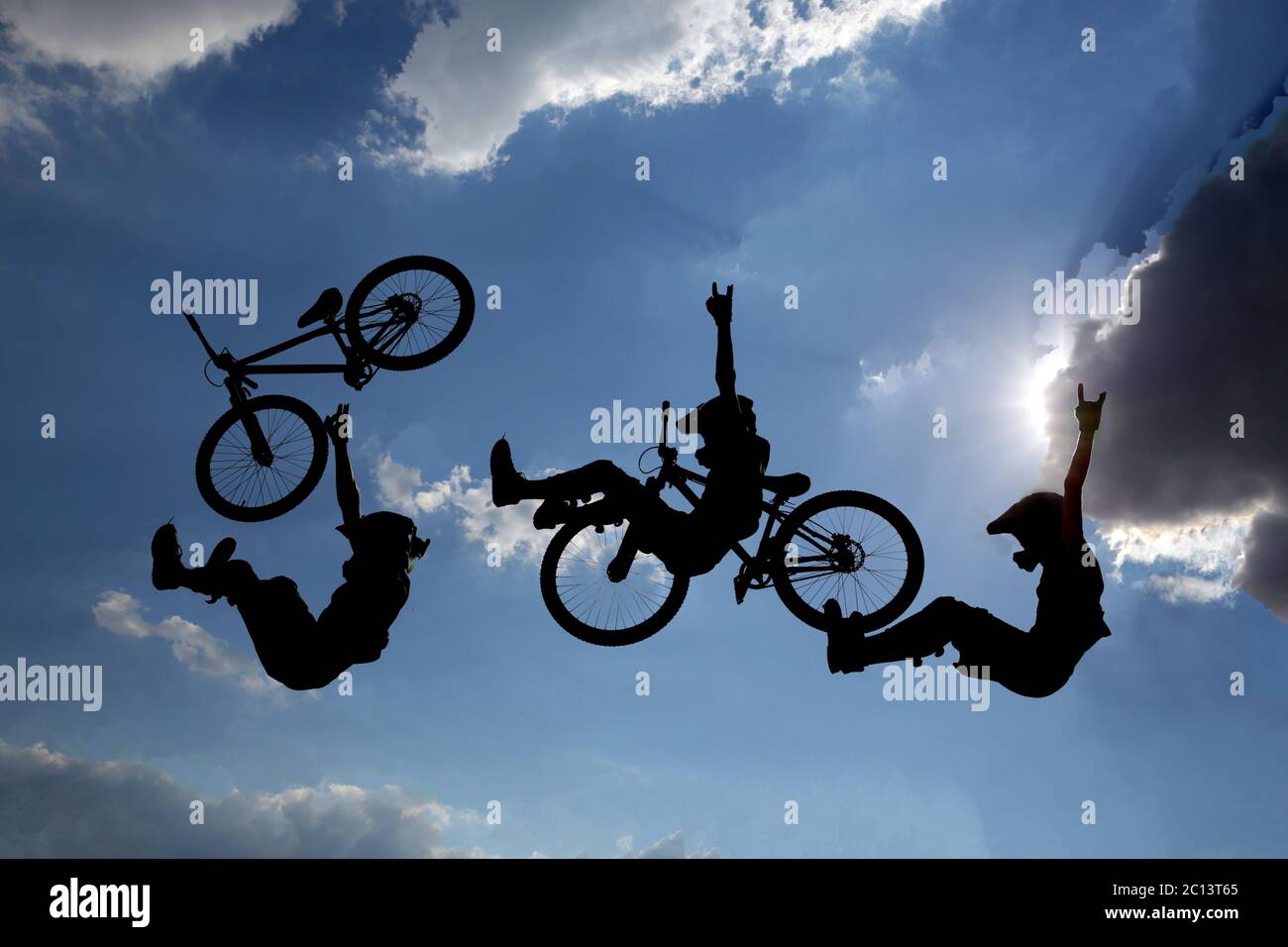 Bike jump silhouettes multiple exposure Stock Photo - Alamy