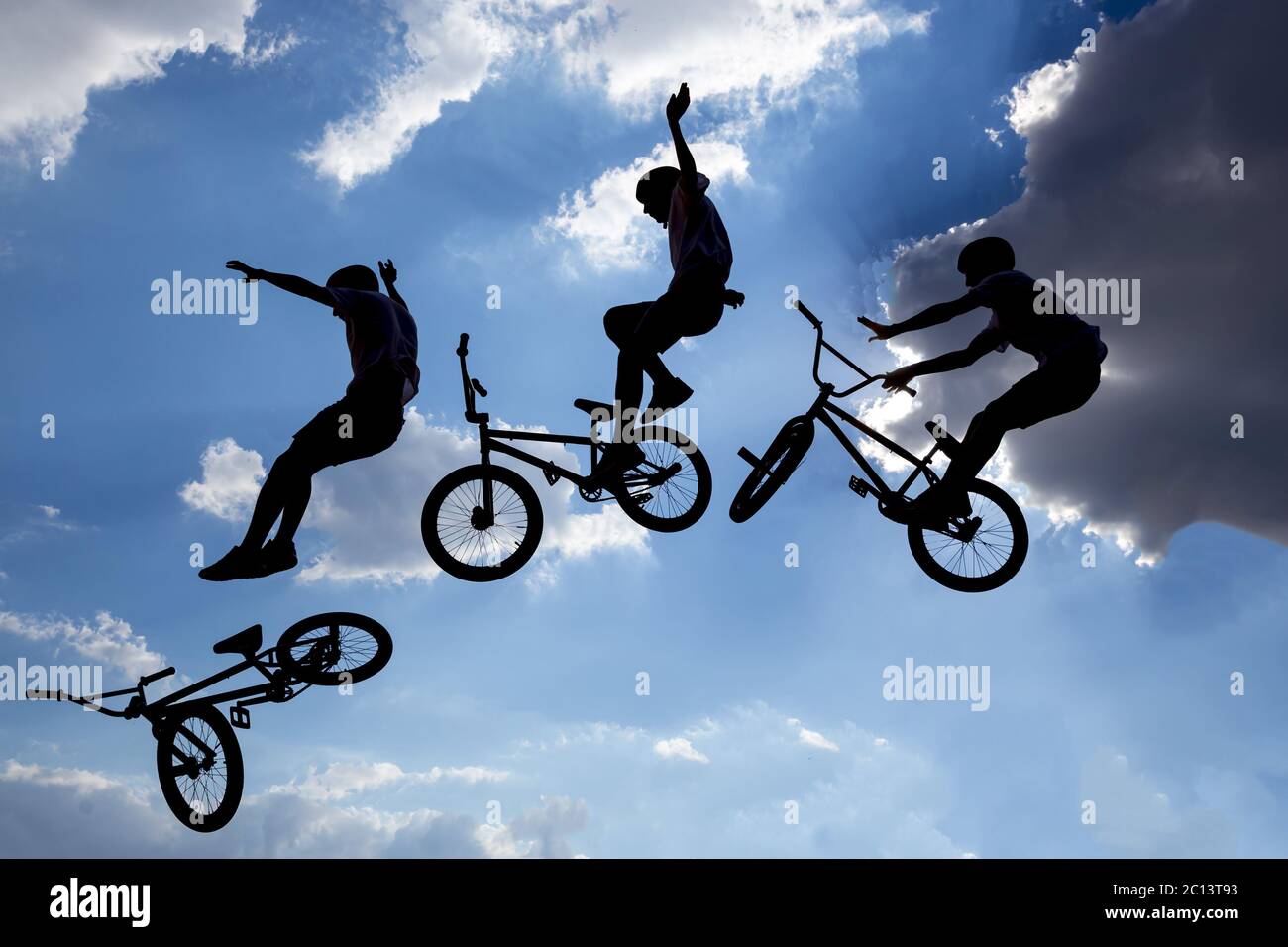 Bike jump silhouettes multiple exposure Stock Photo - Alamy