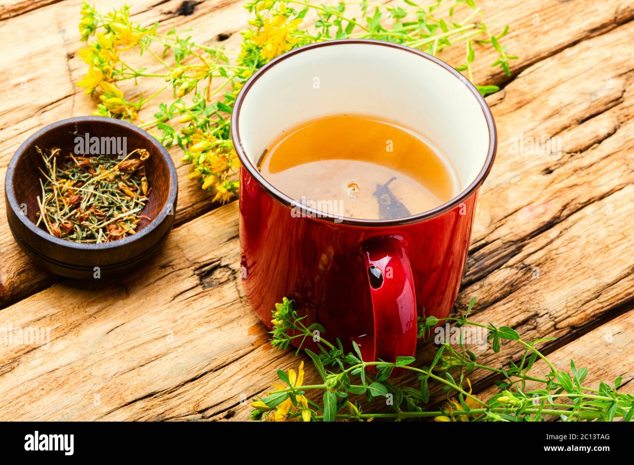 Cups of healthy herbal tea with hypericum.Medicinal herb Stock Photo ...