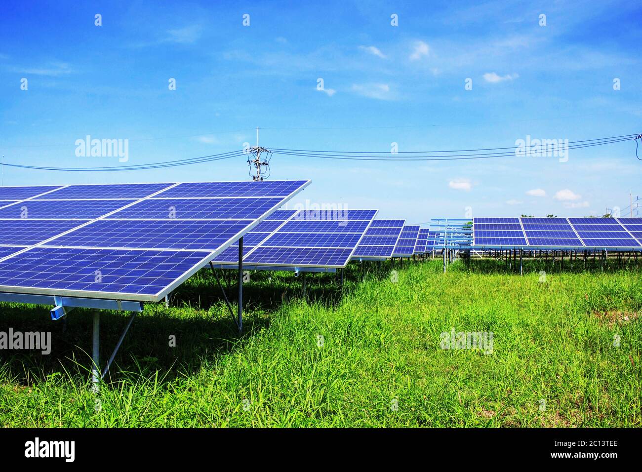 Solar panels on green grass Stock Photo - Alamy