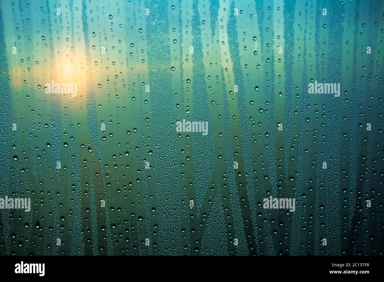 Water droplets on glass with the sunrise Stock Photo - Alamy