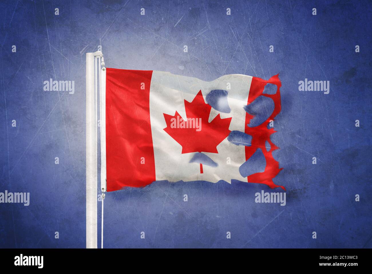 Torn flag of Canada flying against grunge background Stock Photo - Alamy