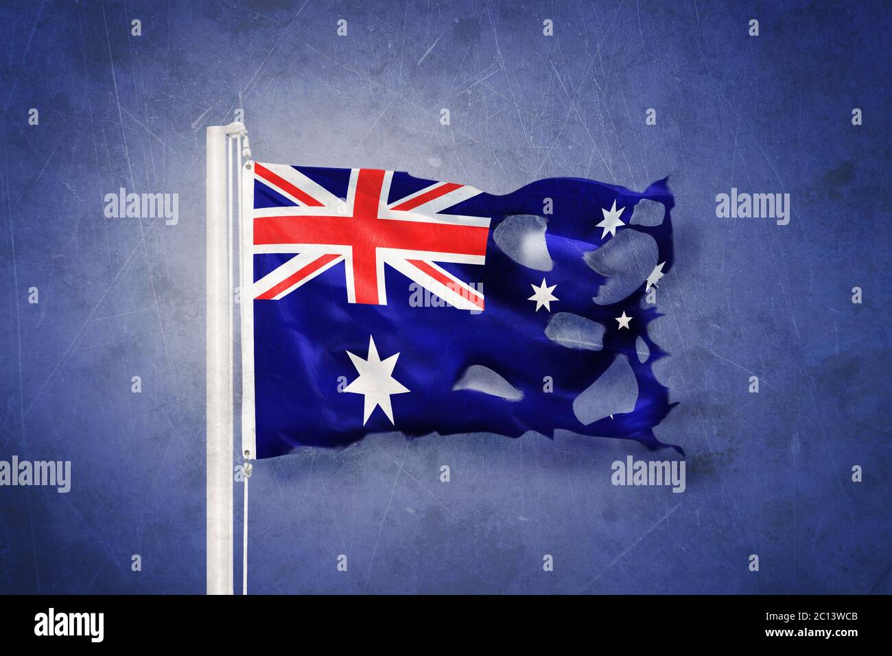 Torn flag of Australia flying against grunge background Stock Photo - Alamy