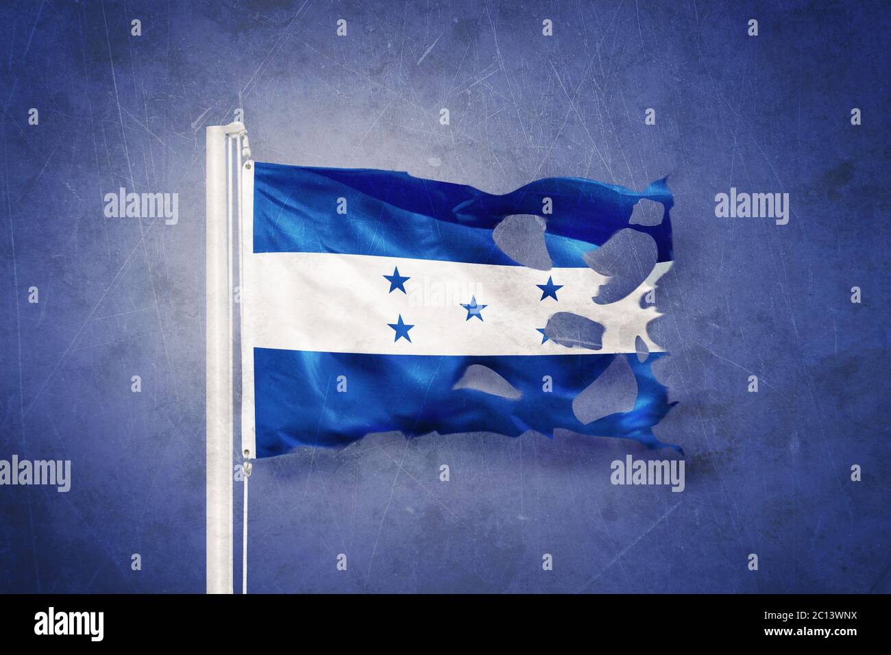 Torn flag of Honduras flying against grunge background Stock Photo - Alamy