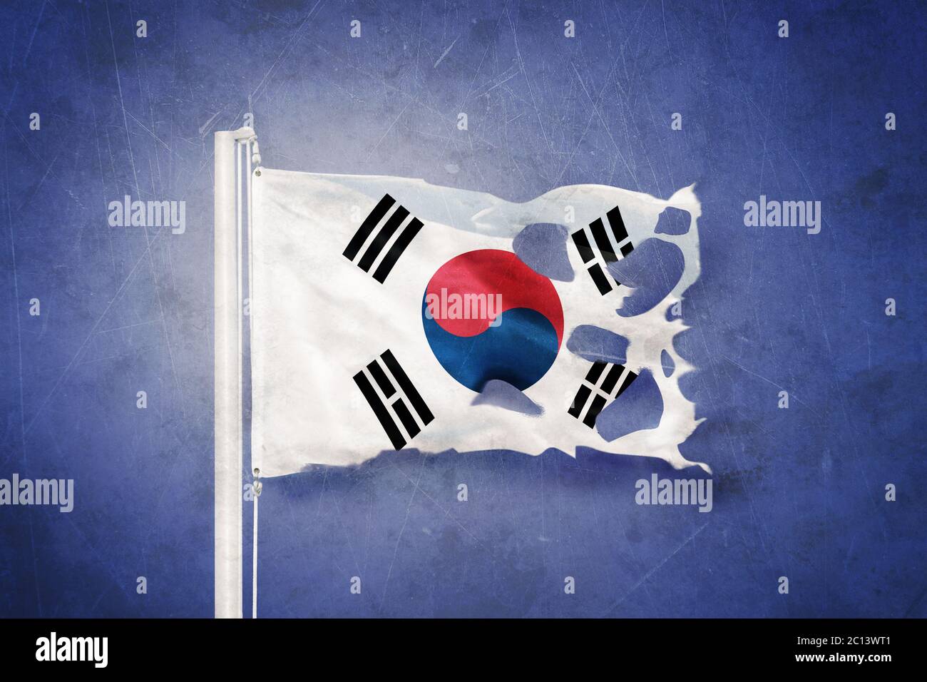 Torn flag of South Korea flying against grunge background Stock Photo ...
