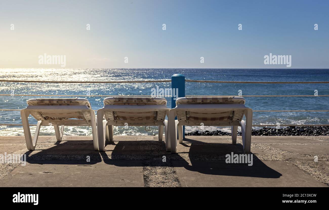three old sun beds Stock Photo - Alamy