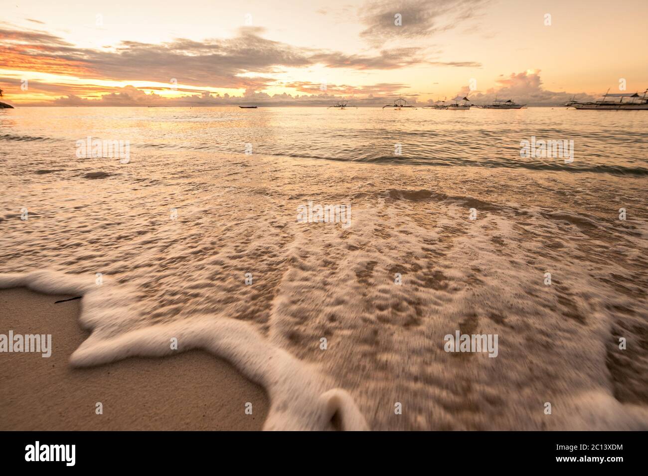 Tropical beach sunset at Philippines Stock Photo - Alamy