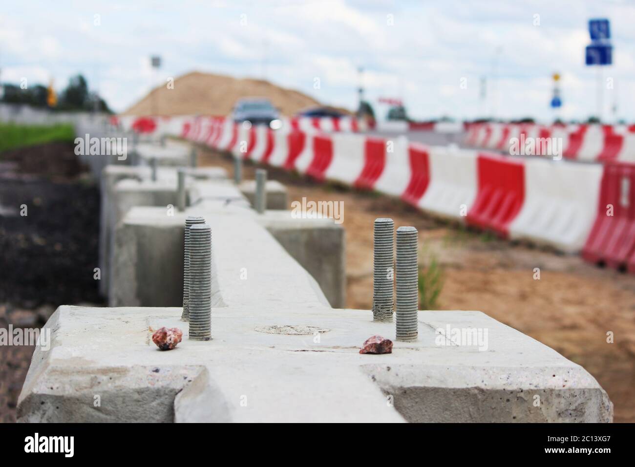 construction of road junction at the viaduct with concrete barriers and ...