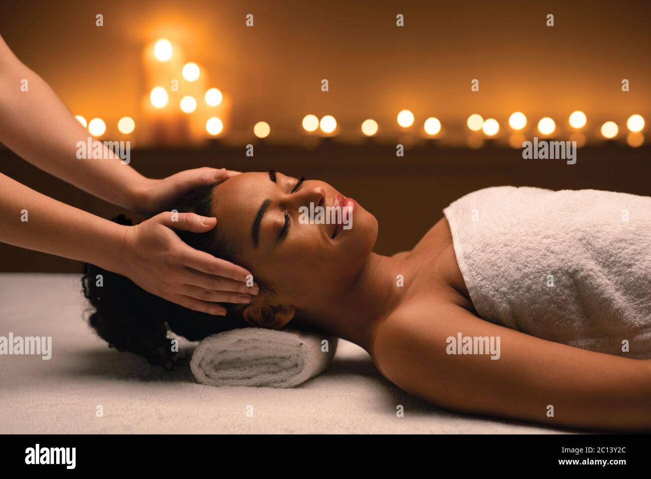 Peaceful african woman attending luxury spa salon Stock Photo - Alamy