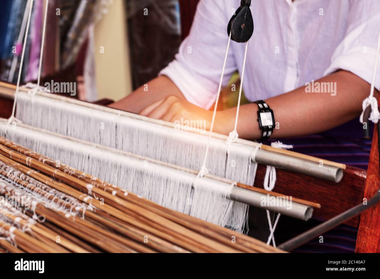 Woman weaving cloth spinning hi-res stock photography and images - Alamy