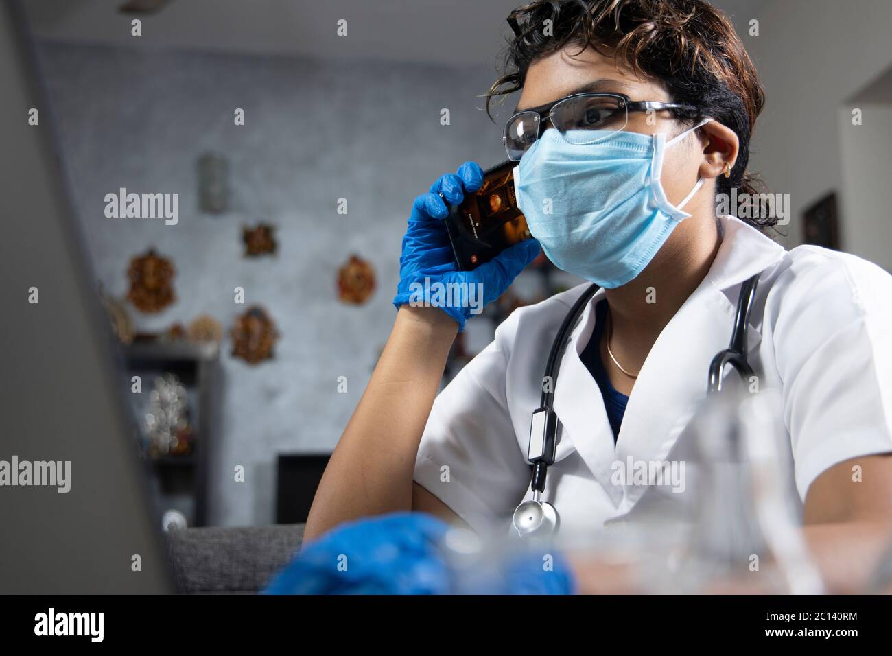 Young female doctor supporting a patient using Mobile phone during lock ...