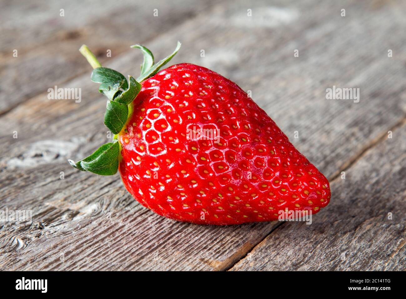 One fresh big red strawberry Stock Photo - Alamy