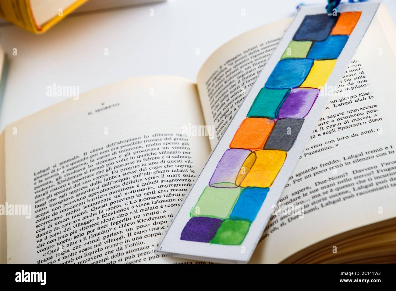 colorful bookmark on an open book. education. reading Stock Photo - Alamy