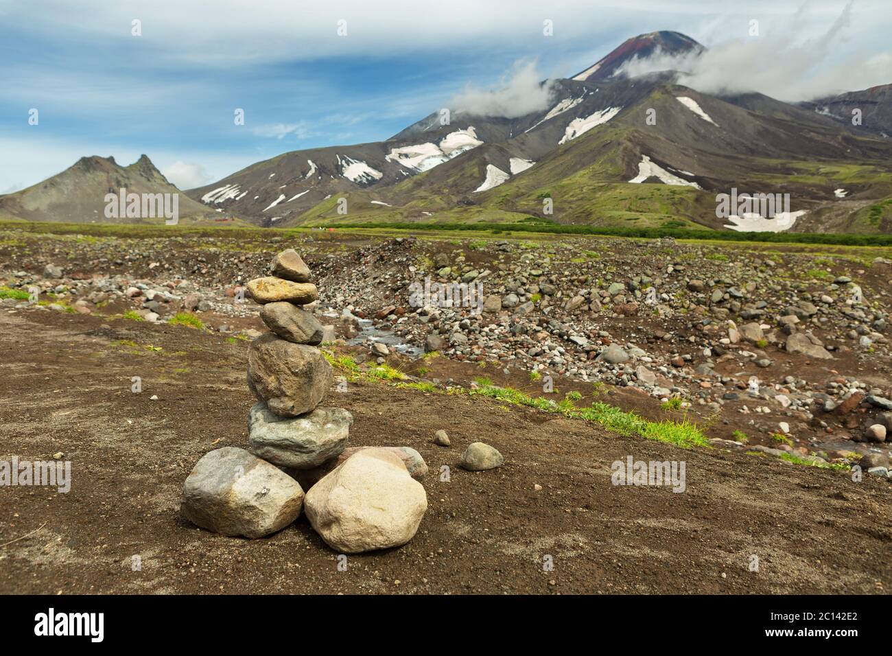Pyramid of stones on a background of Avacha Volcano or Avachinskaya ...