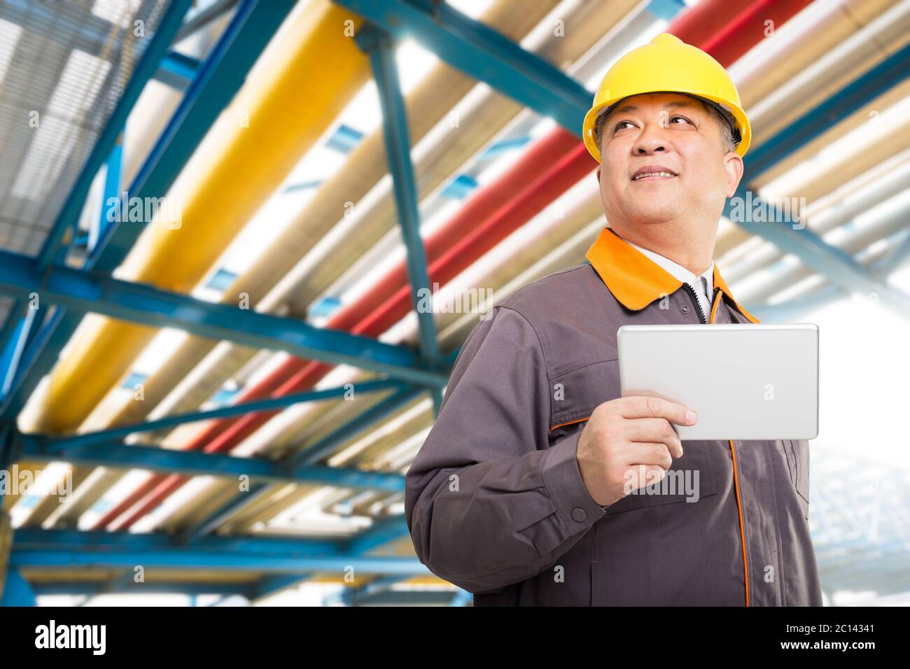 old chinese man engineer in oil refinery plant Stock Photo - Alamy