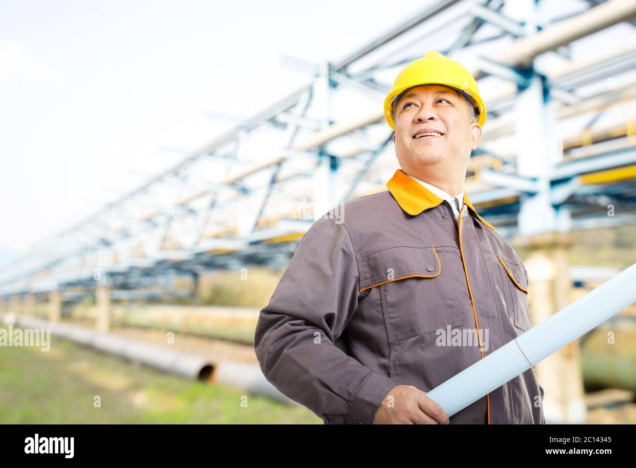 old chinese man engineer in oil refinery plant Stock Photo - Alamy