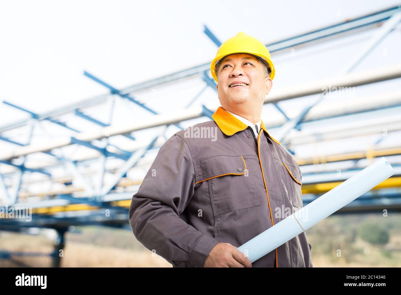 old chinese man engineer in oil refinery plant Stock Photo - Alamy