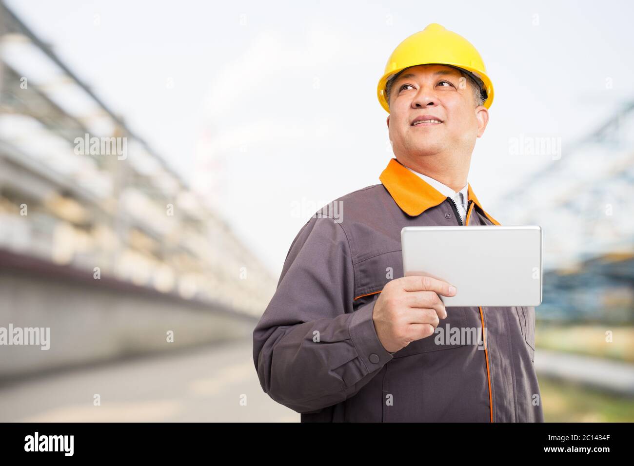 old chinese man engineer in oil refinery plant Stock Photo - Alamy
