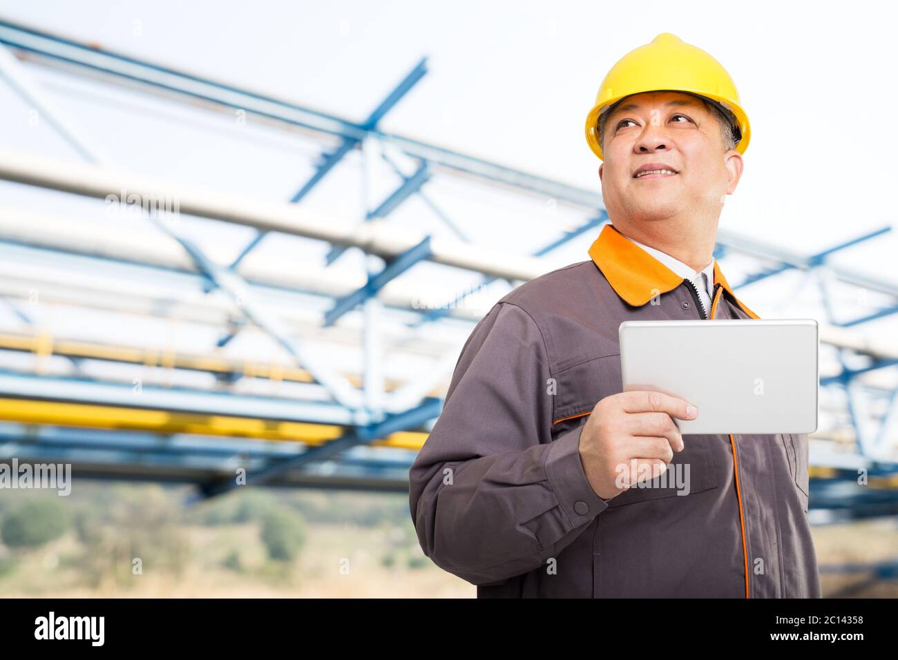 old chinese man engineer in oil refinery plant Stock Photo - Alamy