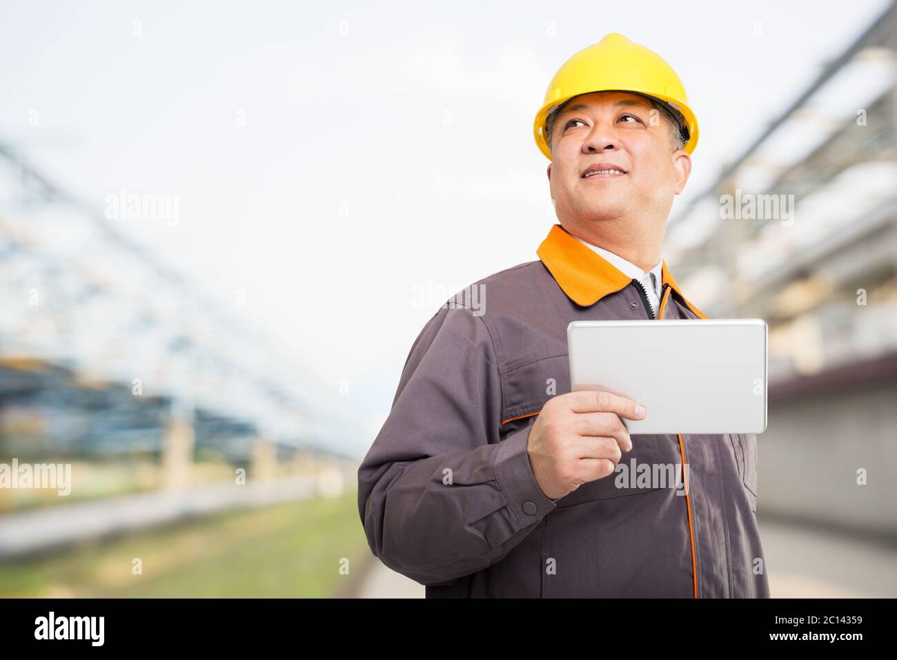 old chinese man engineer in oil refinery plant Stock Photo - Alamy