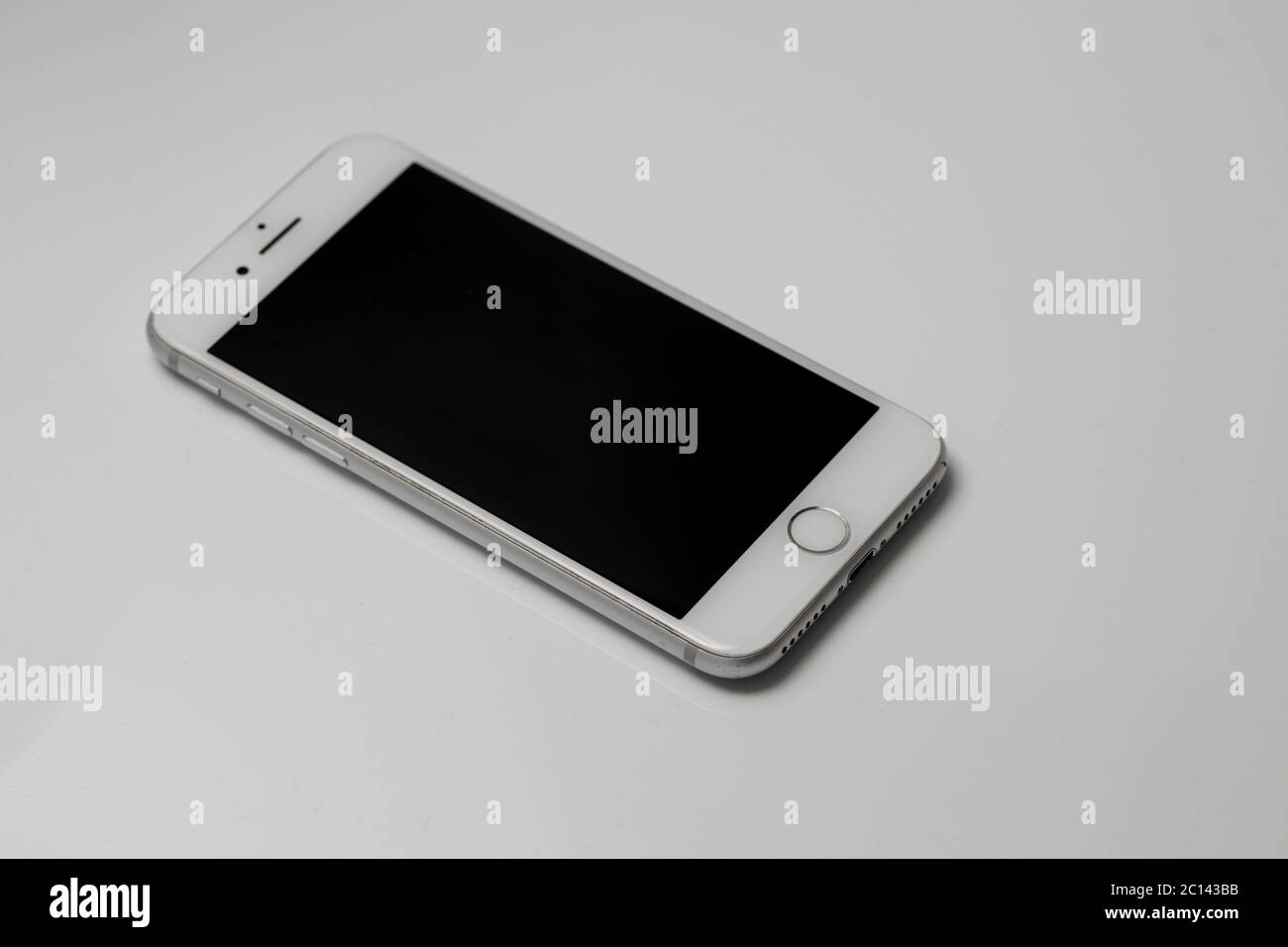 A White mobile phone with blank / black screen Stock Photo - Alamy