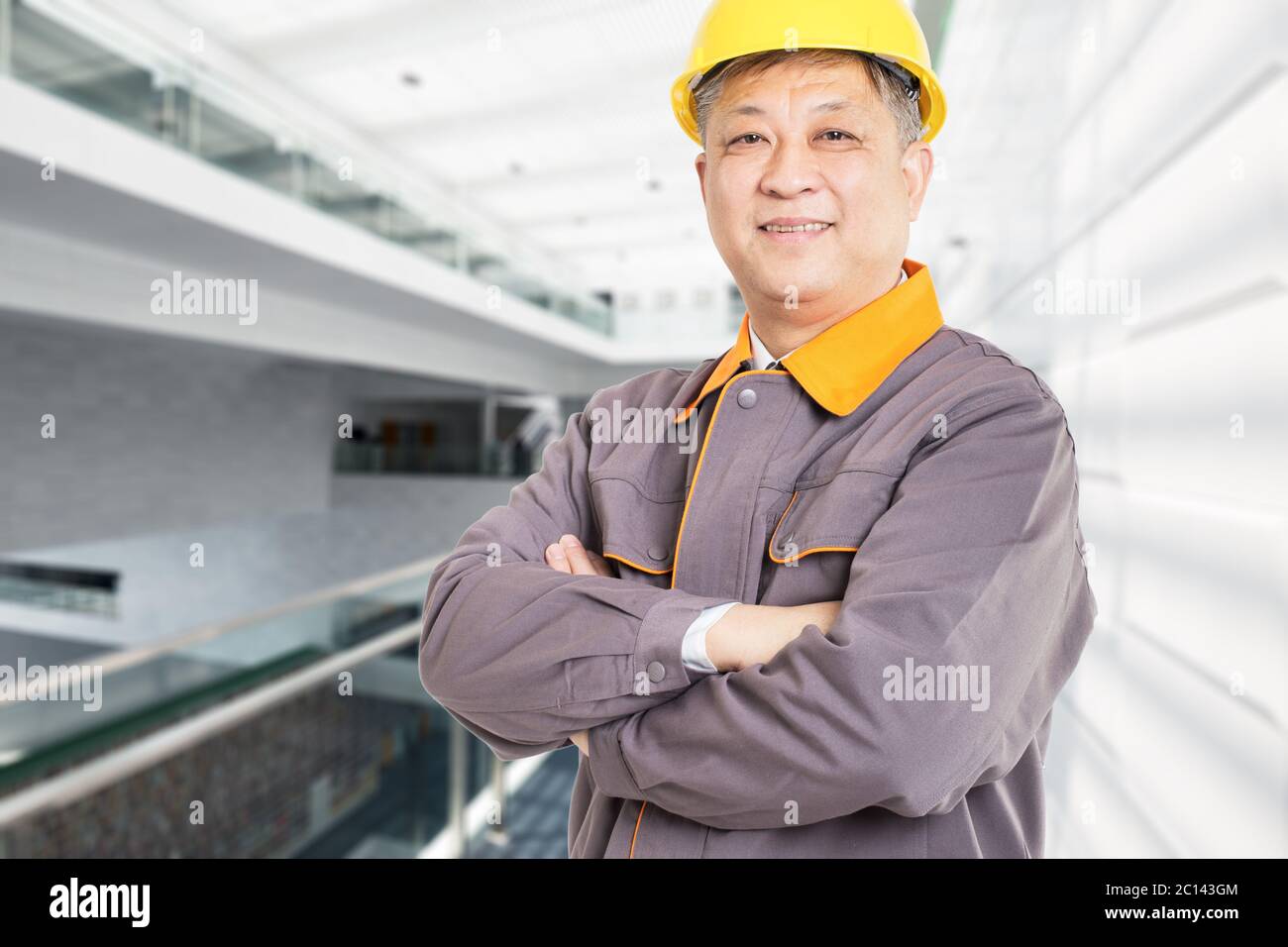 old asian man engineer in modern factory Stock Photo - Alamy