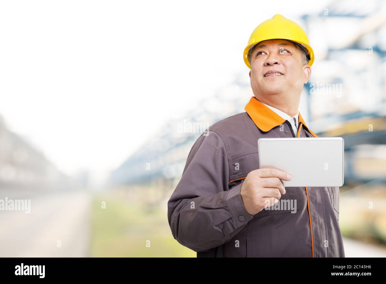 old chinese man engineer in oil refinery plant Stock Photo - Alamy