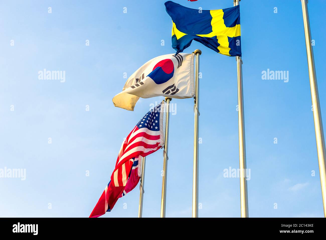 national flags flying in wind Stock Photo - Alamy