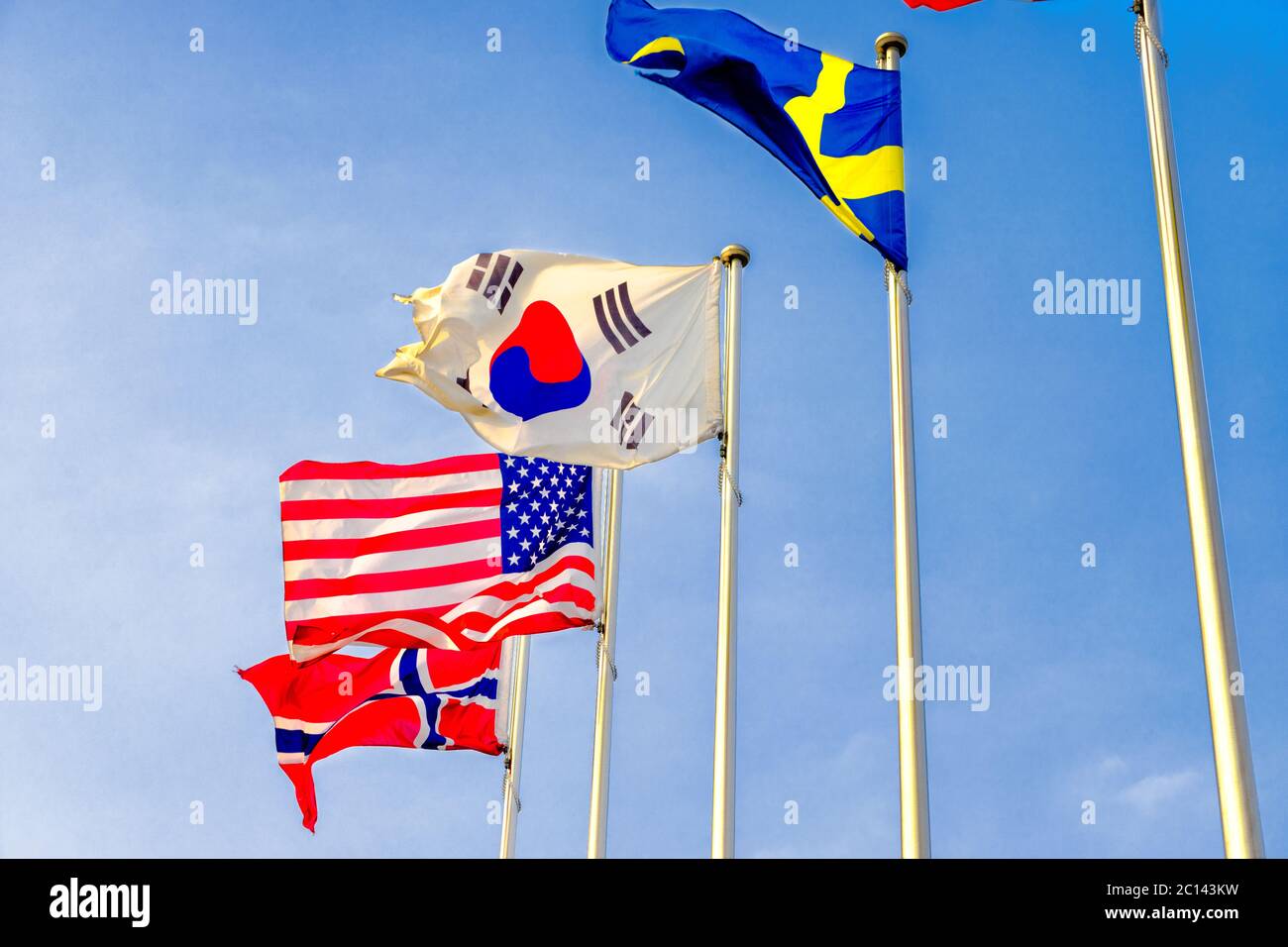 national flags flying in wind Stock Photo - Alamy