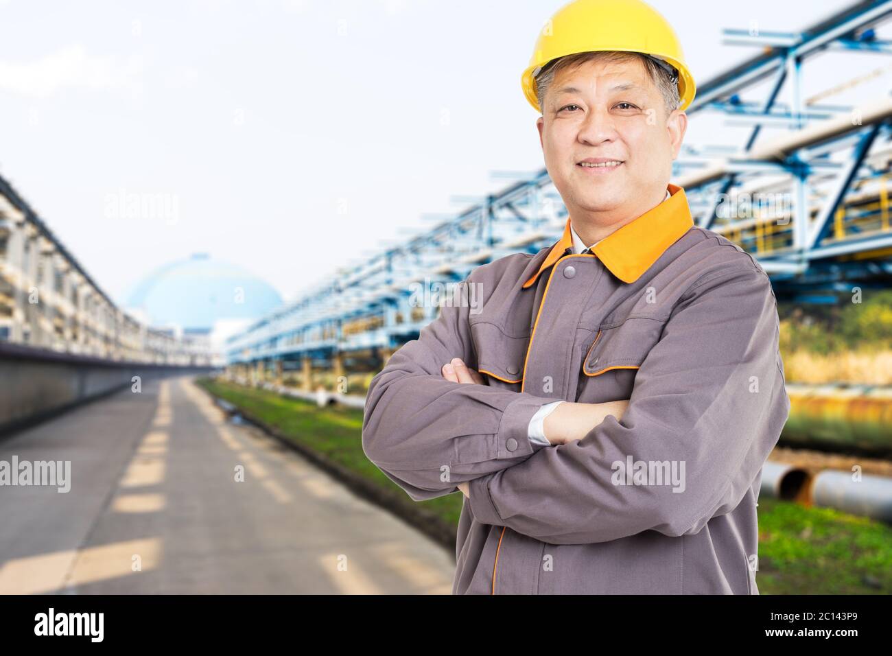 old chinese man engineer in oil refinery plant Stock Photo - Alamy
