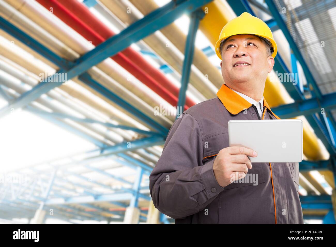 old chinese man engineer in oil refinery plant Stock Photo - Alamy