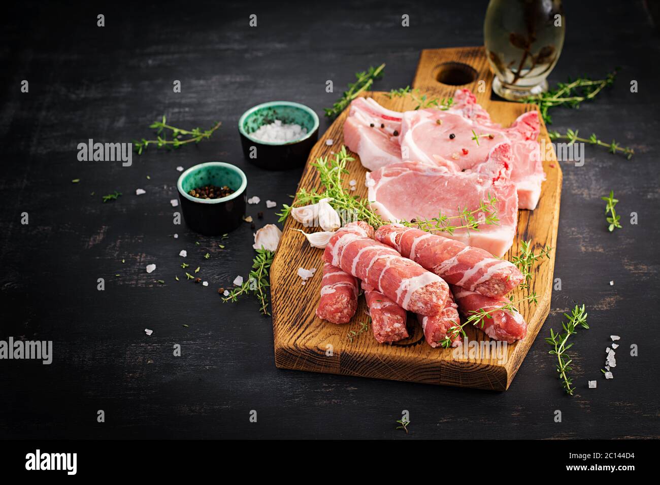 Raw pork steaks. Different types of raw pork meat and chopped sausages ...