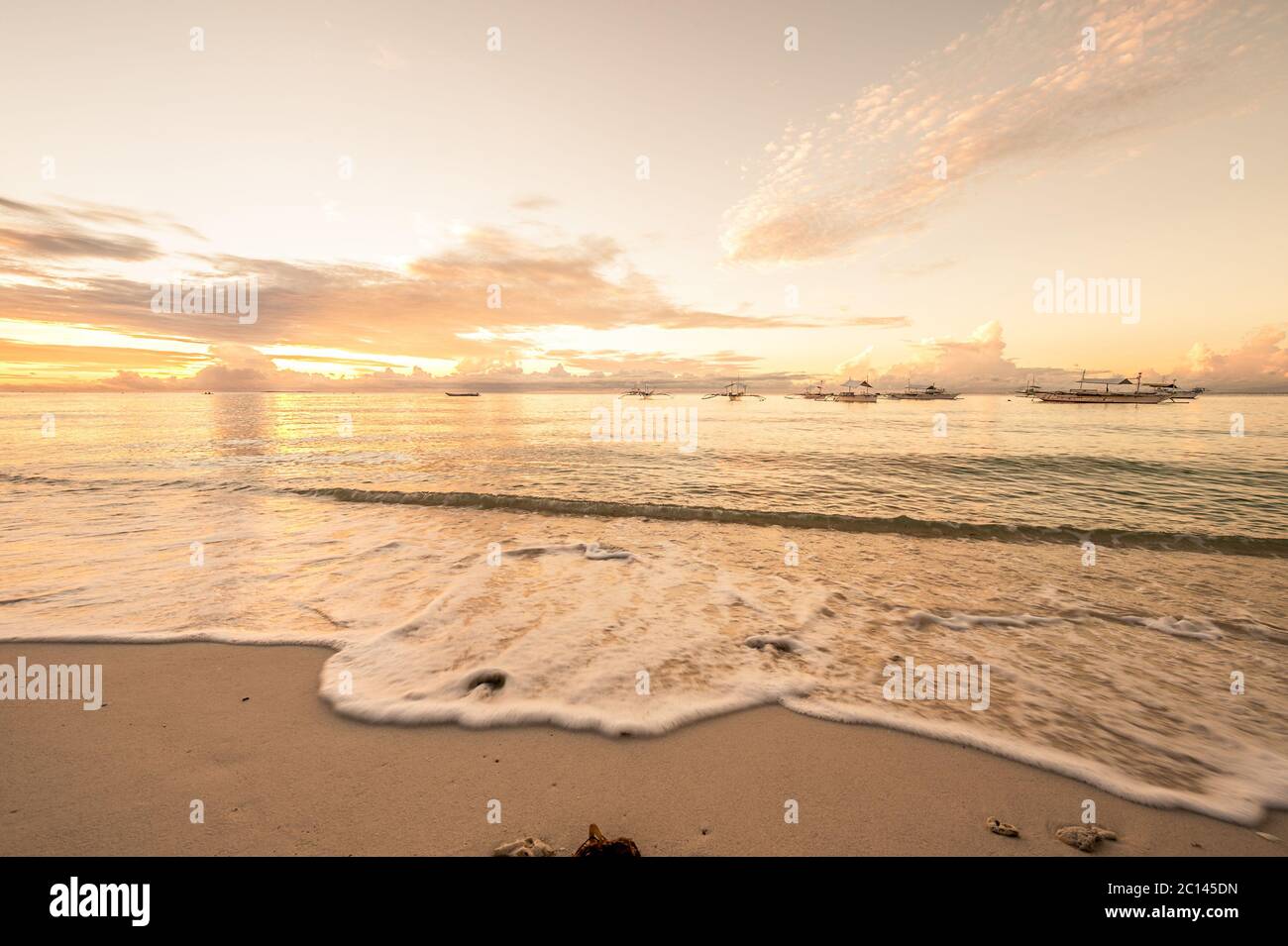 Tropical beach sunset at Philippines Stock Photo - Alamy
