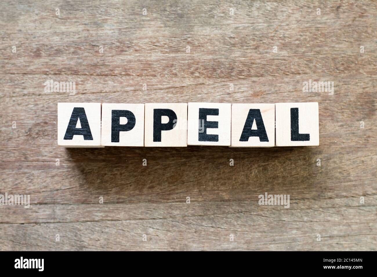 Letter block in word appeal on wood background Stock Photo - Alamy