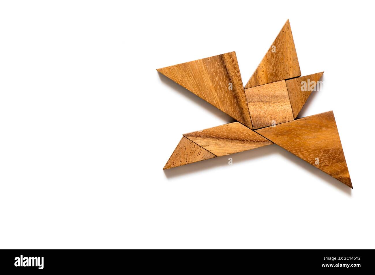 Wood tangram puzzle in flying bird on white background Stock Photo - Alamy