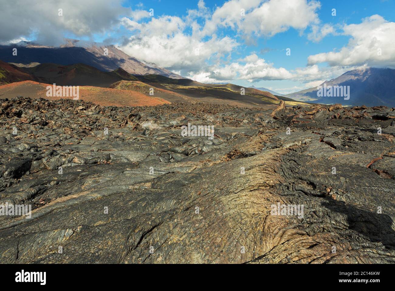 Lava field at Tolbachik volcano, after eruption in 2012 on background ...