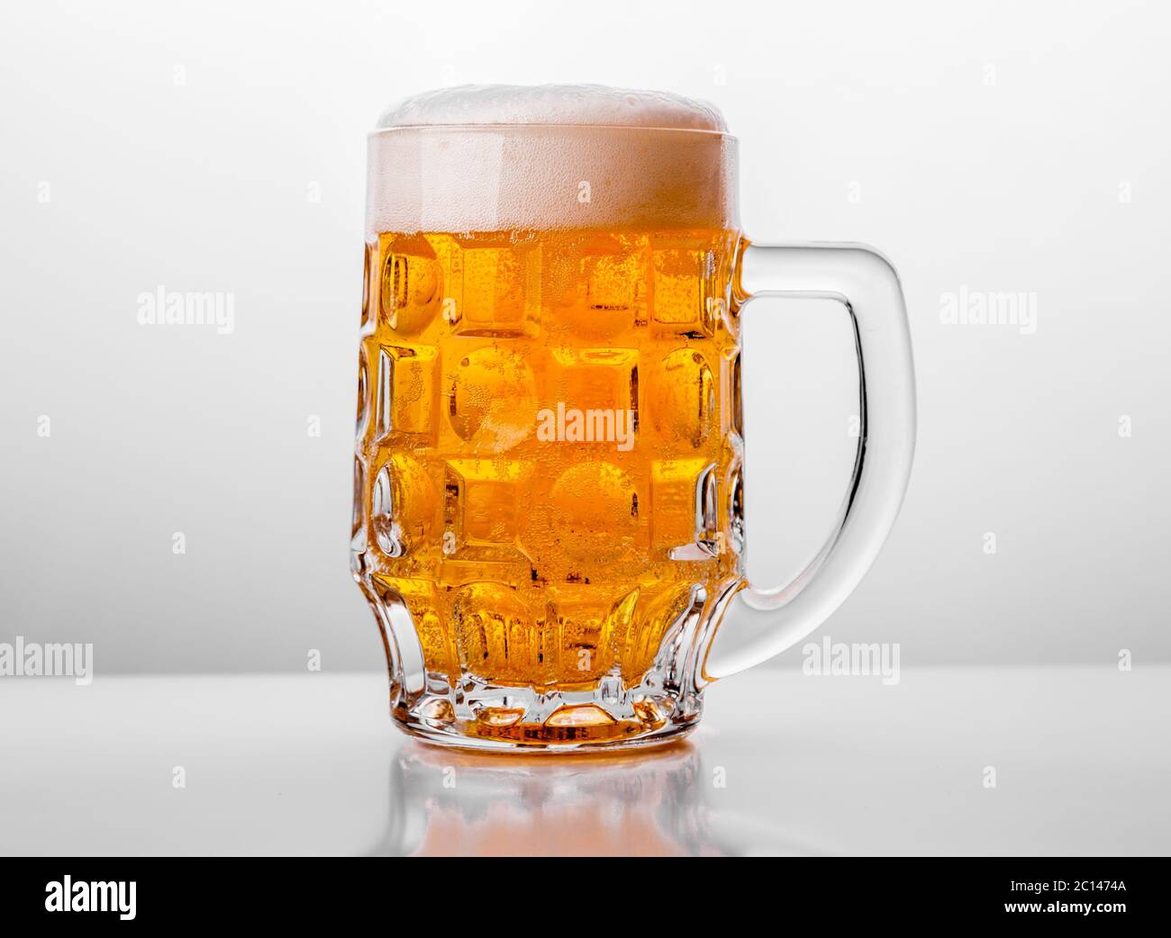 Glass of fresh beer on white background Stock Photo - Alamy