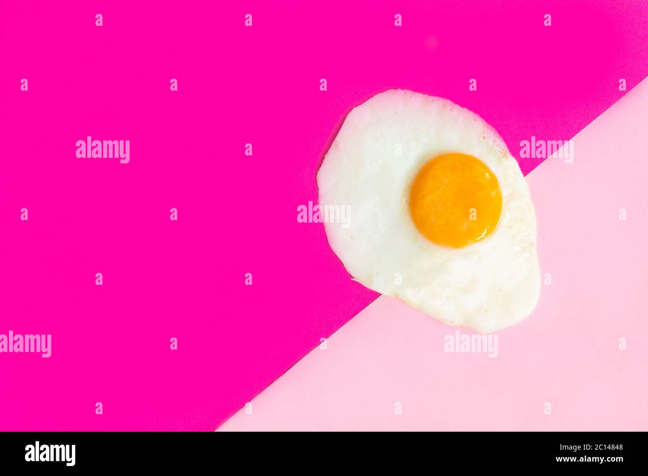A fried egg on pink background, pop art, isolated. Minimal Stock Photo ...