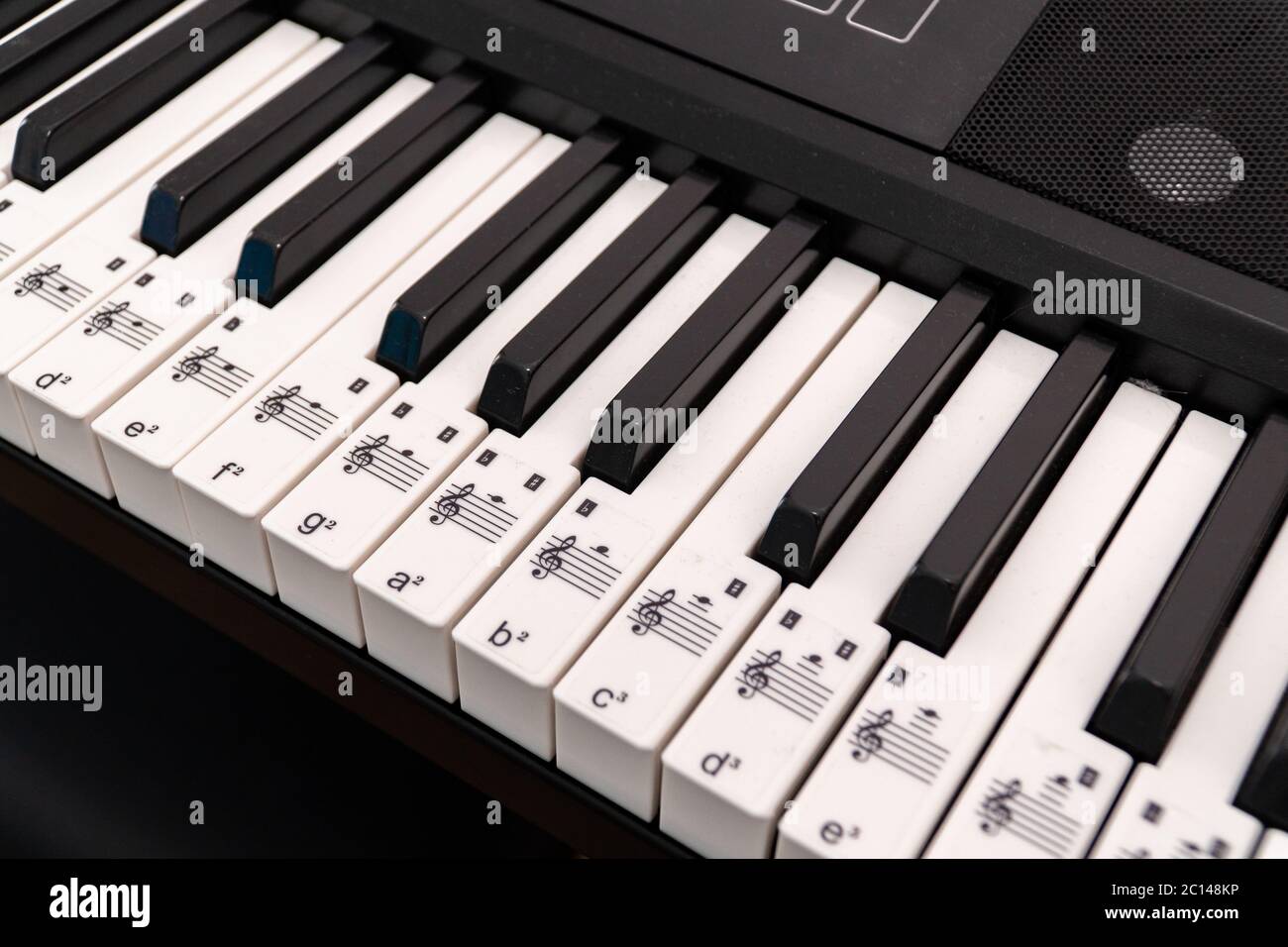 Piano side view with keys lost in the light Stock Photo - Alamy