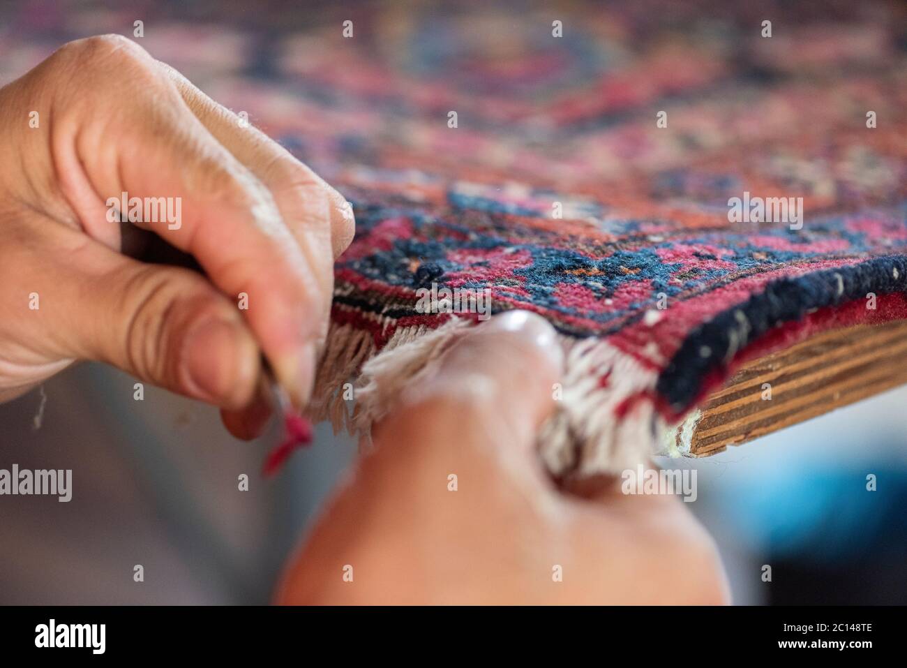 traditional hand sewing fixing old vintage antique persian carpet up ...