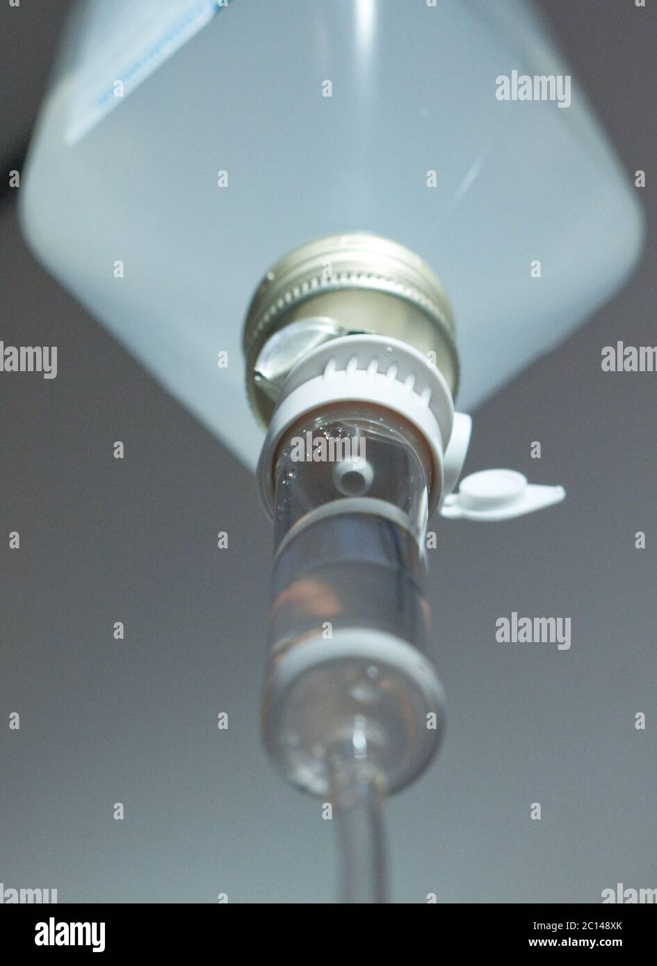 Close up view of an Infusion system in a plastic bottle with gray ...