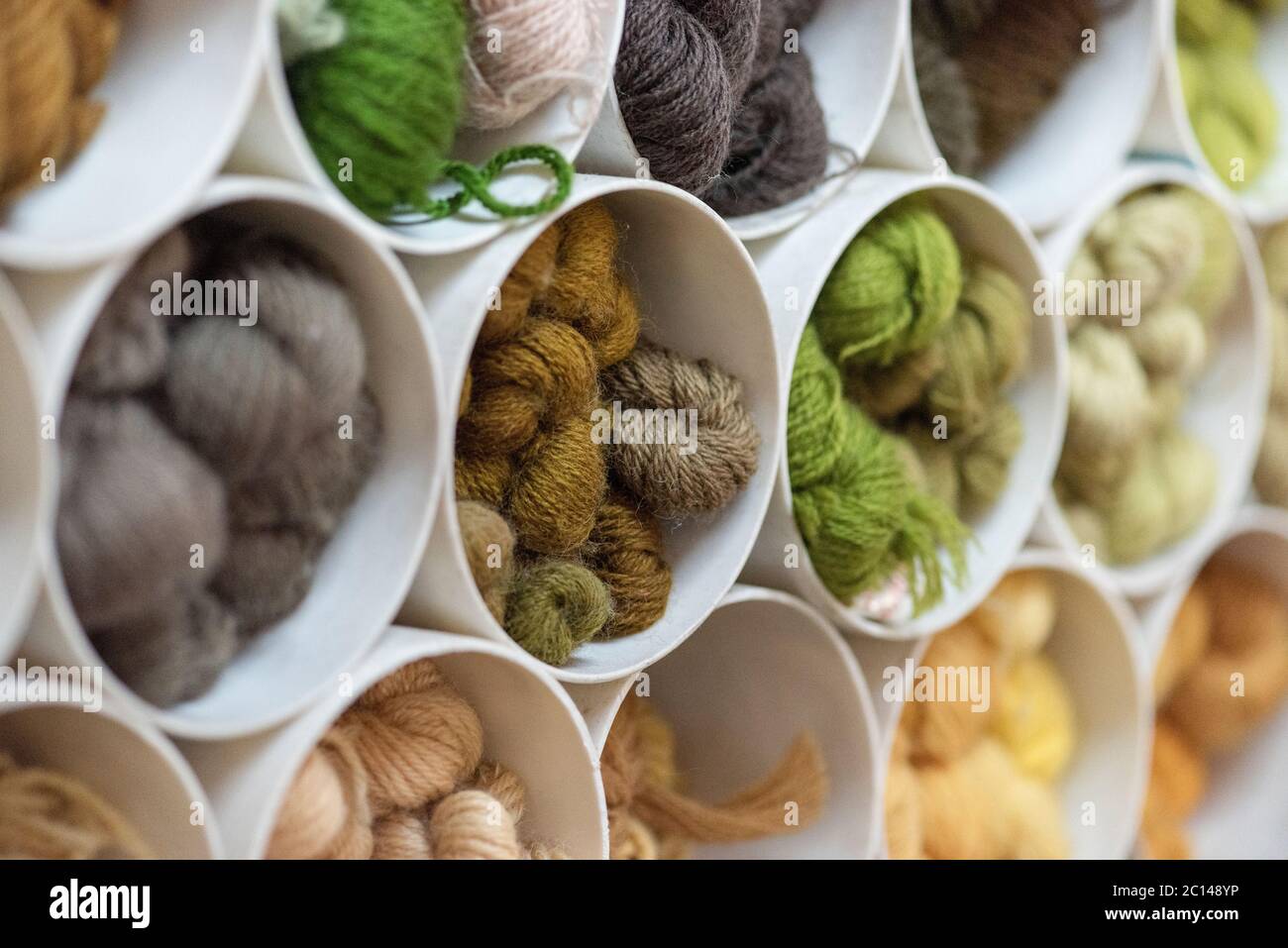 colorful wool yarn storage inside plastic pipes Stock Photo - Alamy