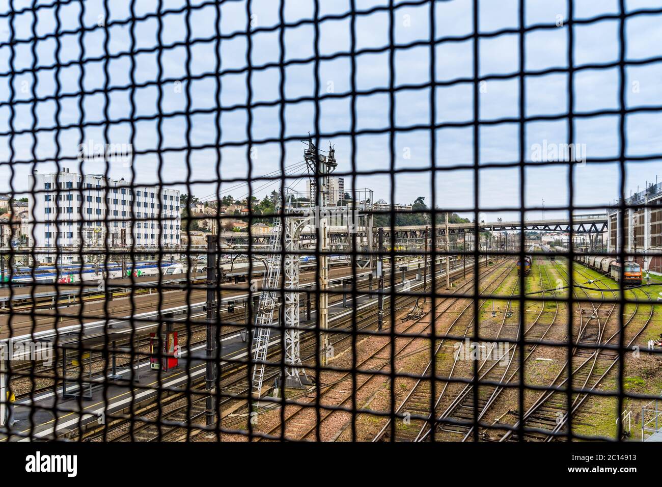 Overhead view of multiple railway tracks through footbridge safety ...
