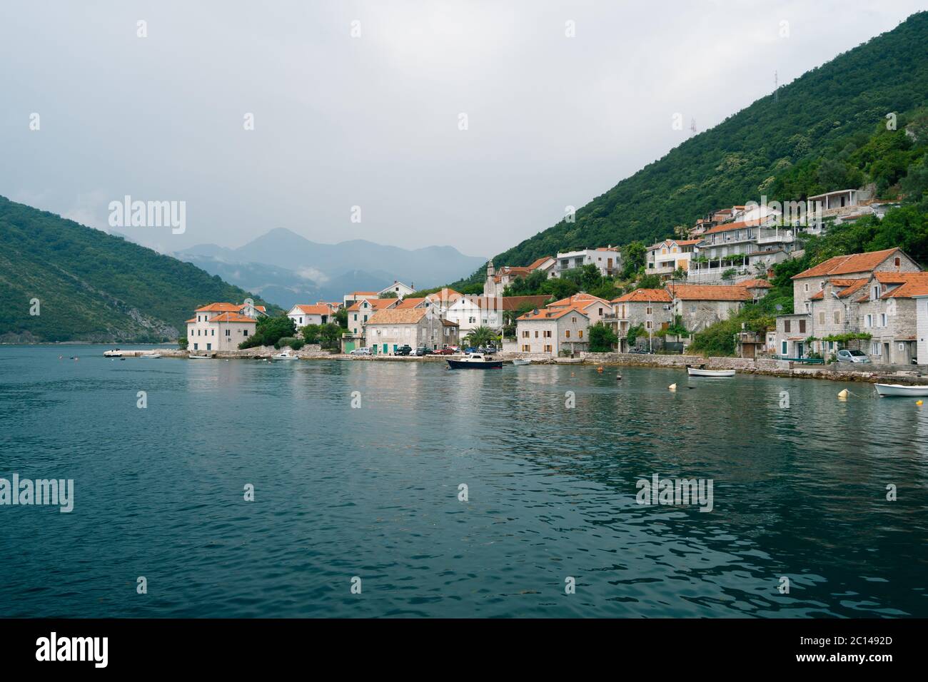 The coastline of the city of Lepetane in Montenegro, near the ferry ...