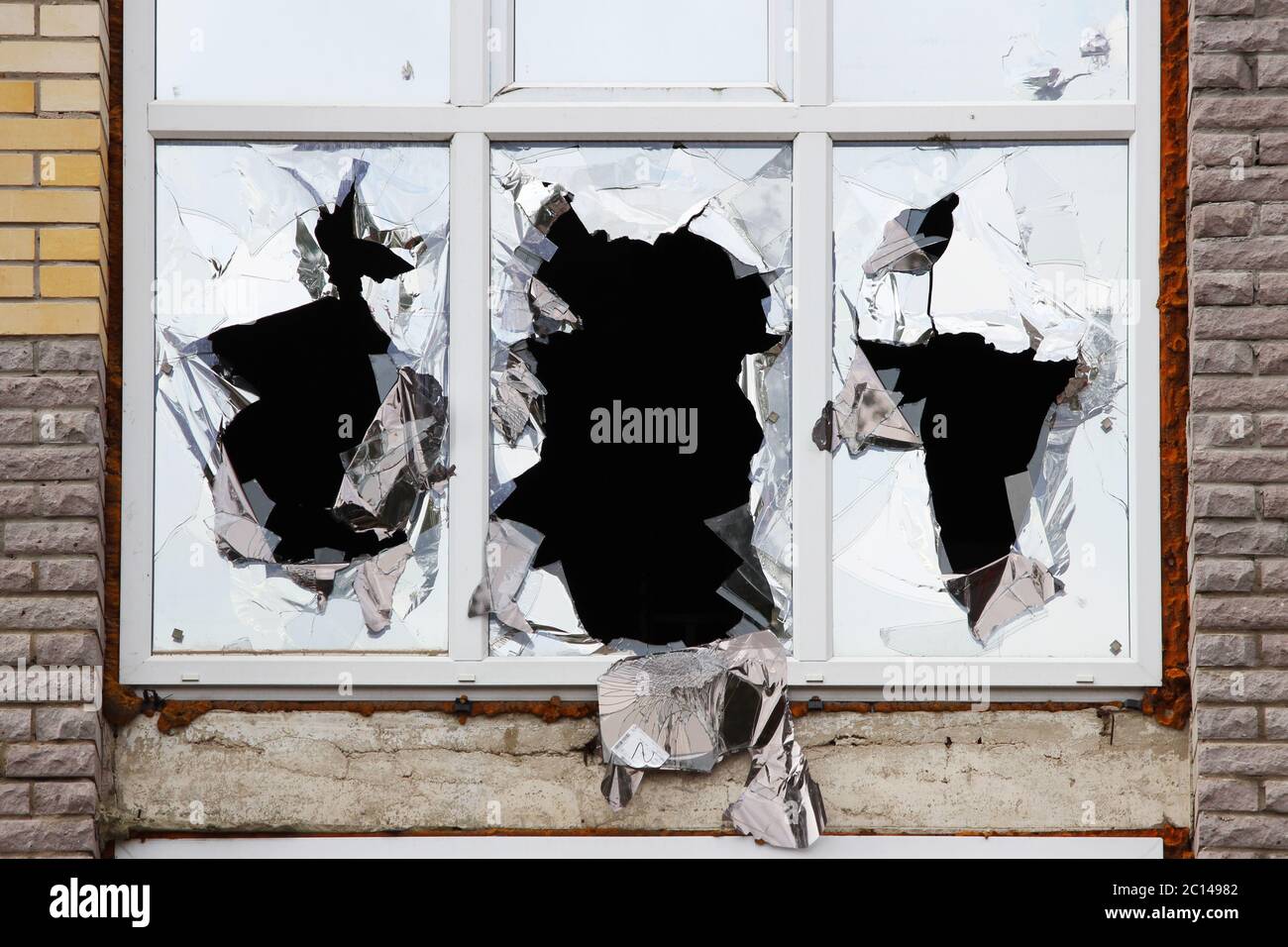Vandals smashed the glass of windows of the an unfinished shopping mall ...