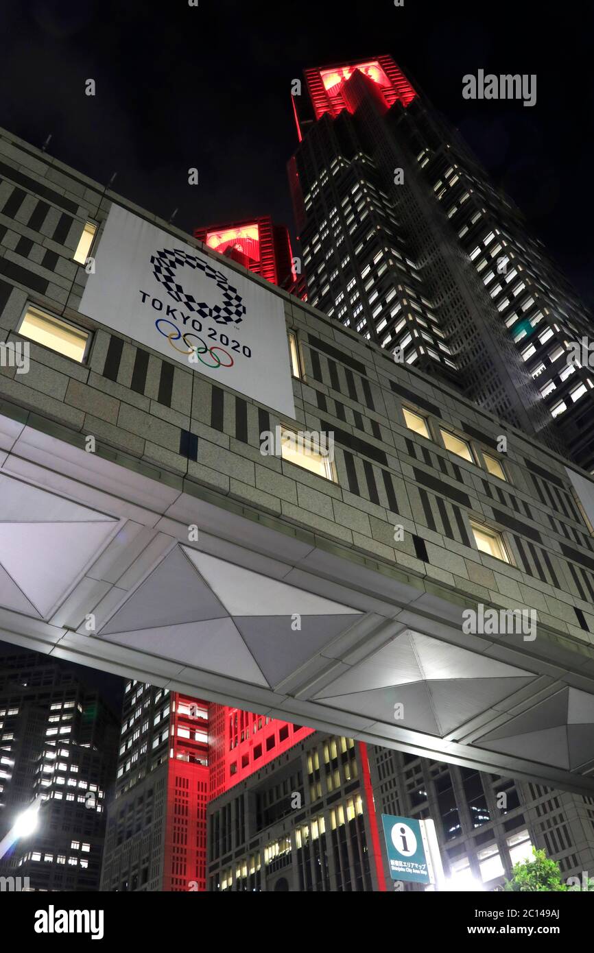 Tokyo metropolitan government building is lit up in red signifying ...