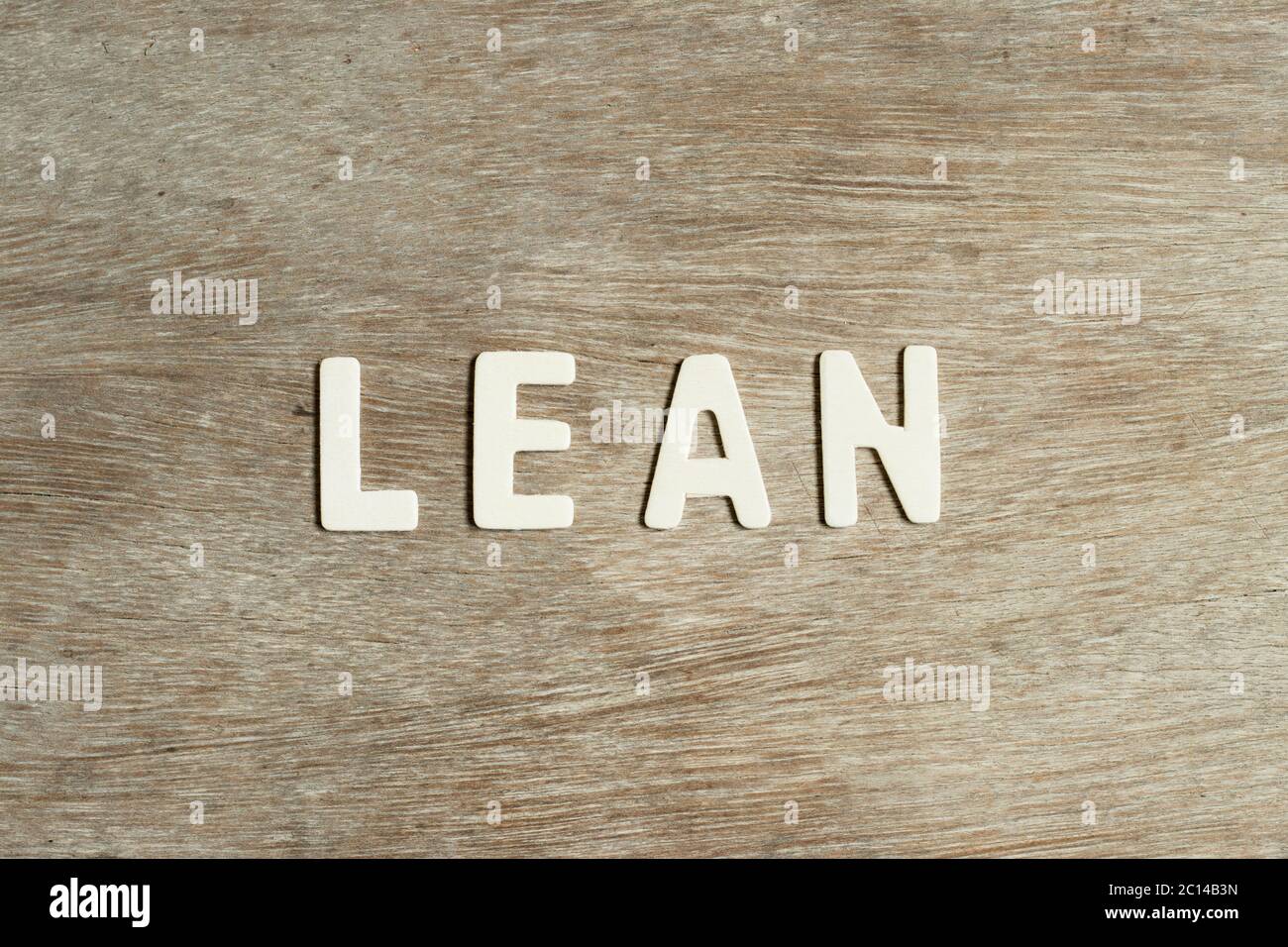 Alphabet letter in word lean on wood background Stock Photo - Alamy
